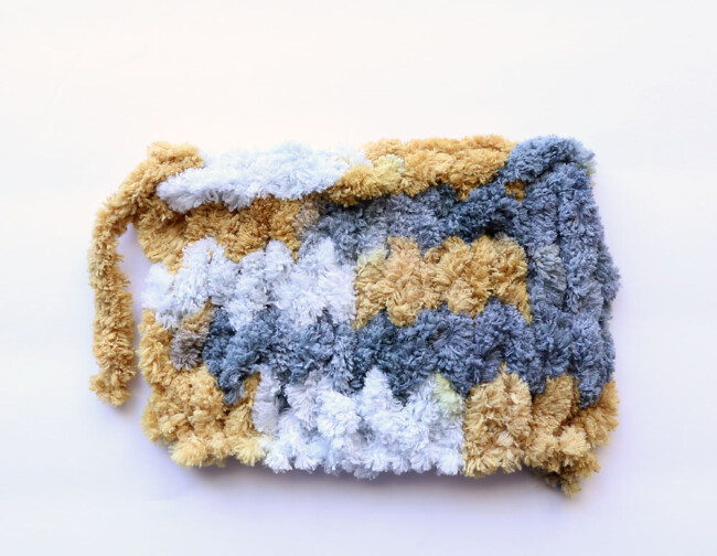 Make a gorgeous cable knit blanket with looping yarn (it's so easy ...